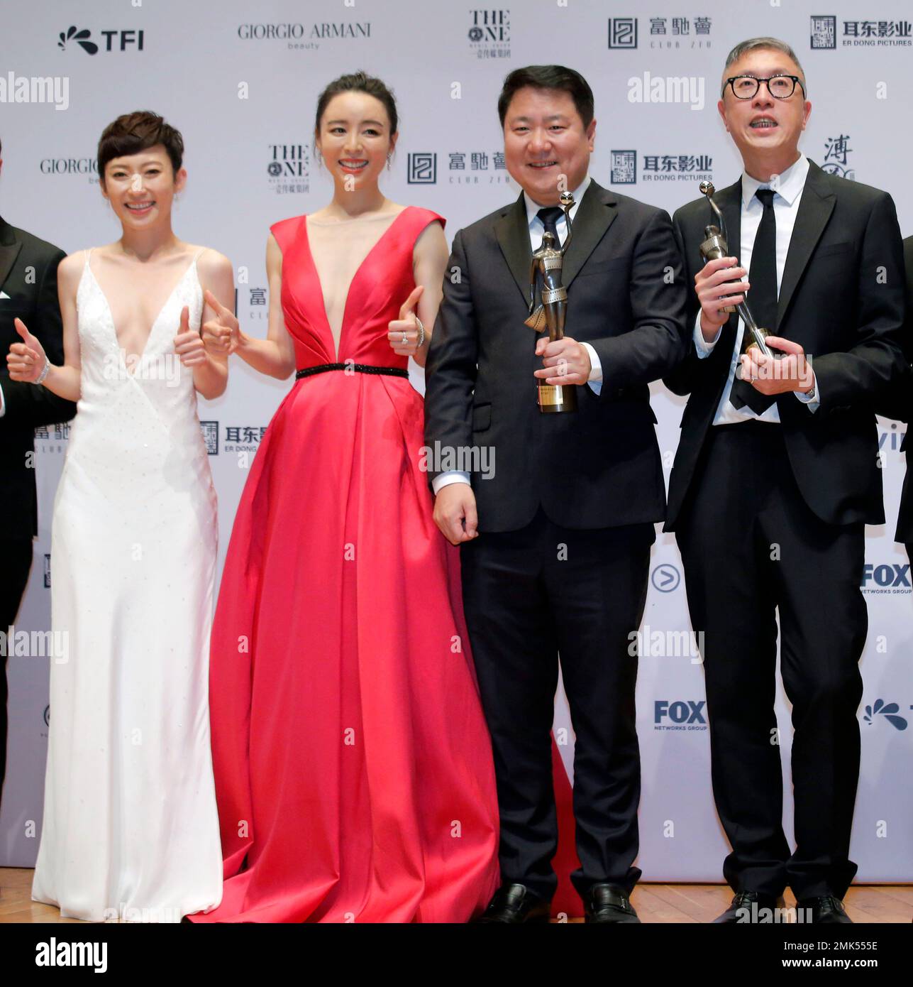 From right, Hong Kong director Felix Chong, Chinese film producer Yu ...