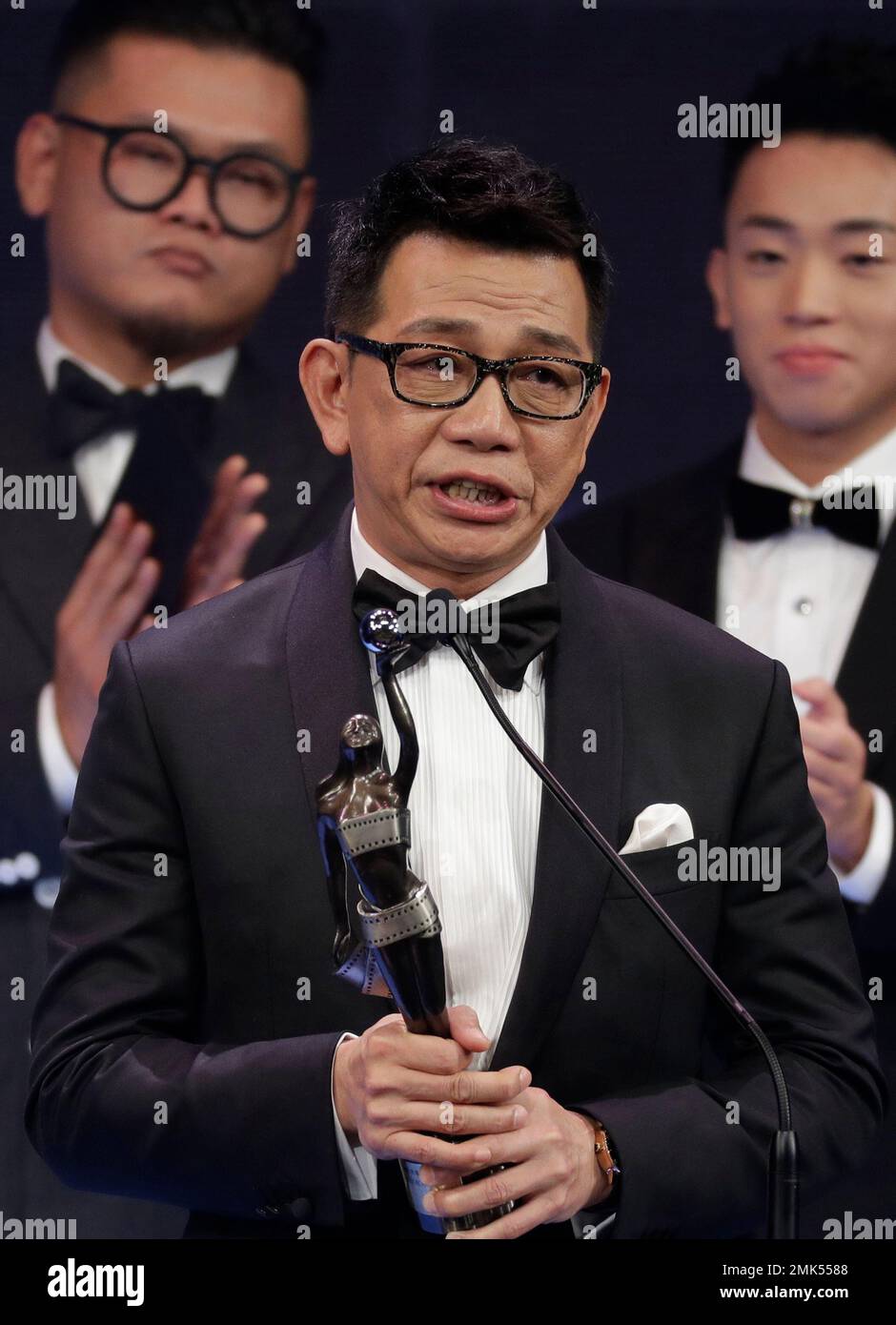 Hong Kong actor Ben Yuen speaks after winning the Best Supporting Actor ...