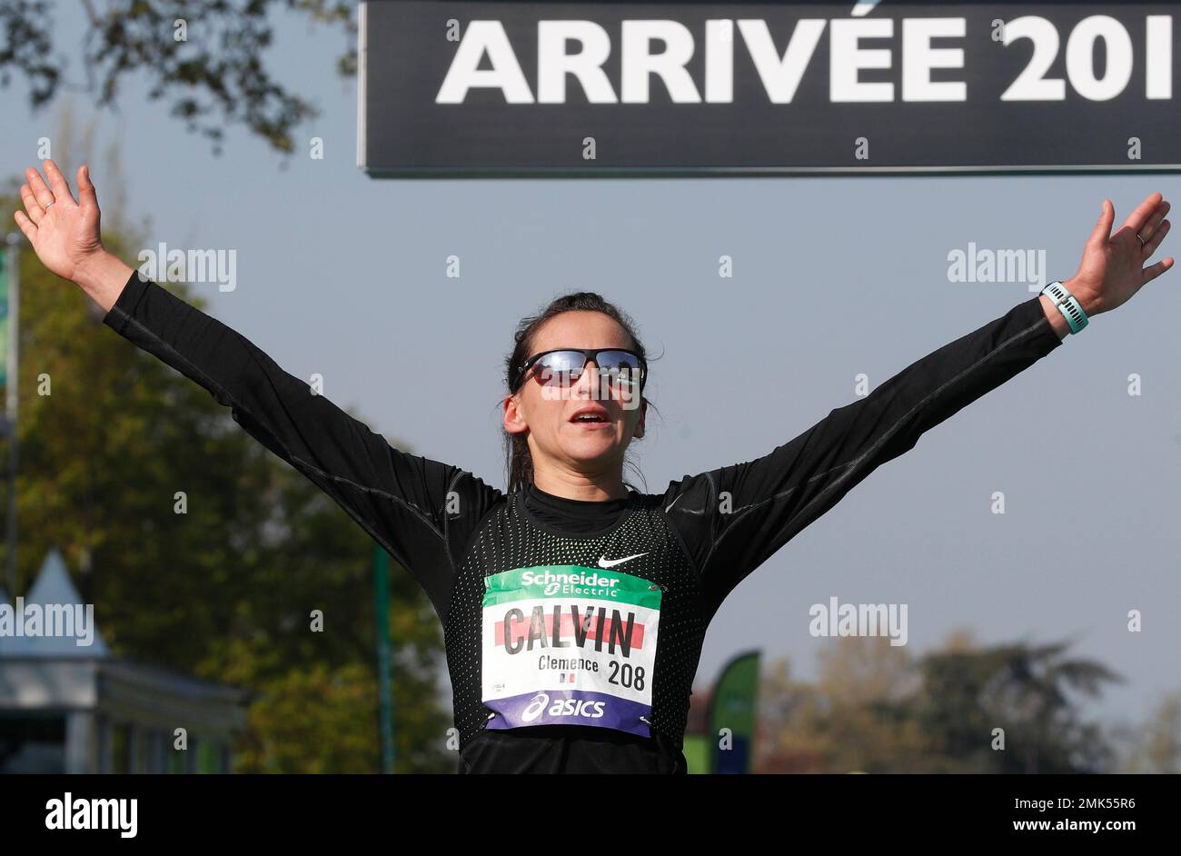 Clemence Calvin of France reacts after cossing the finishing line in ...