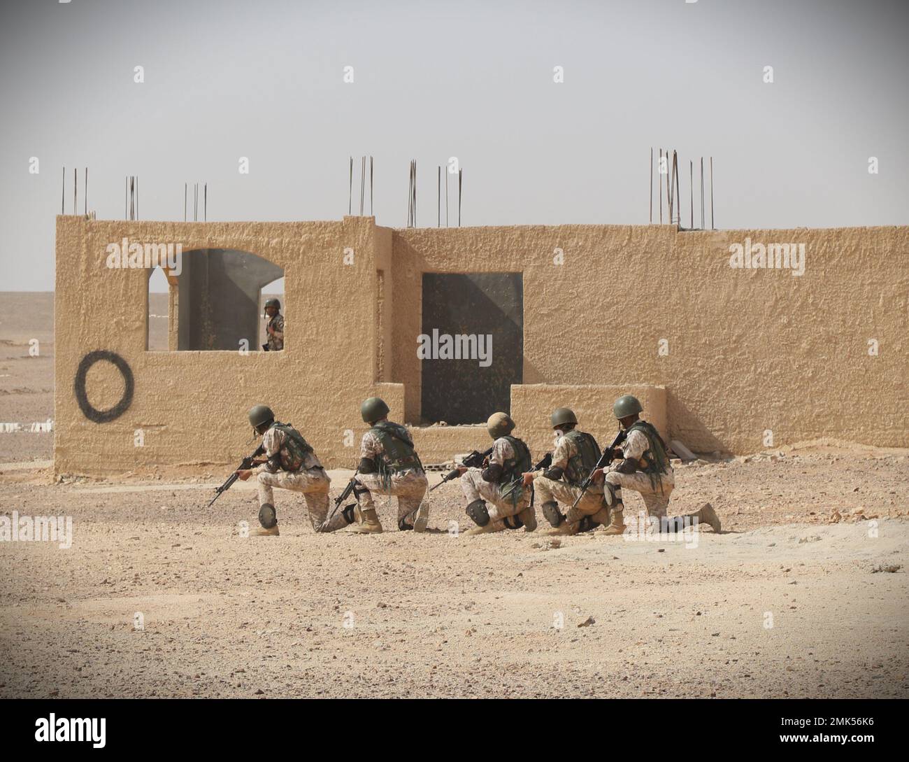 Soldiers from the Jordanian Armed Forces prepare to conduct squad-level ...