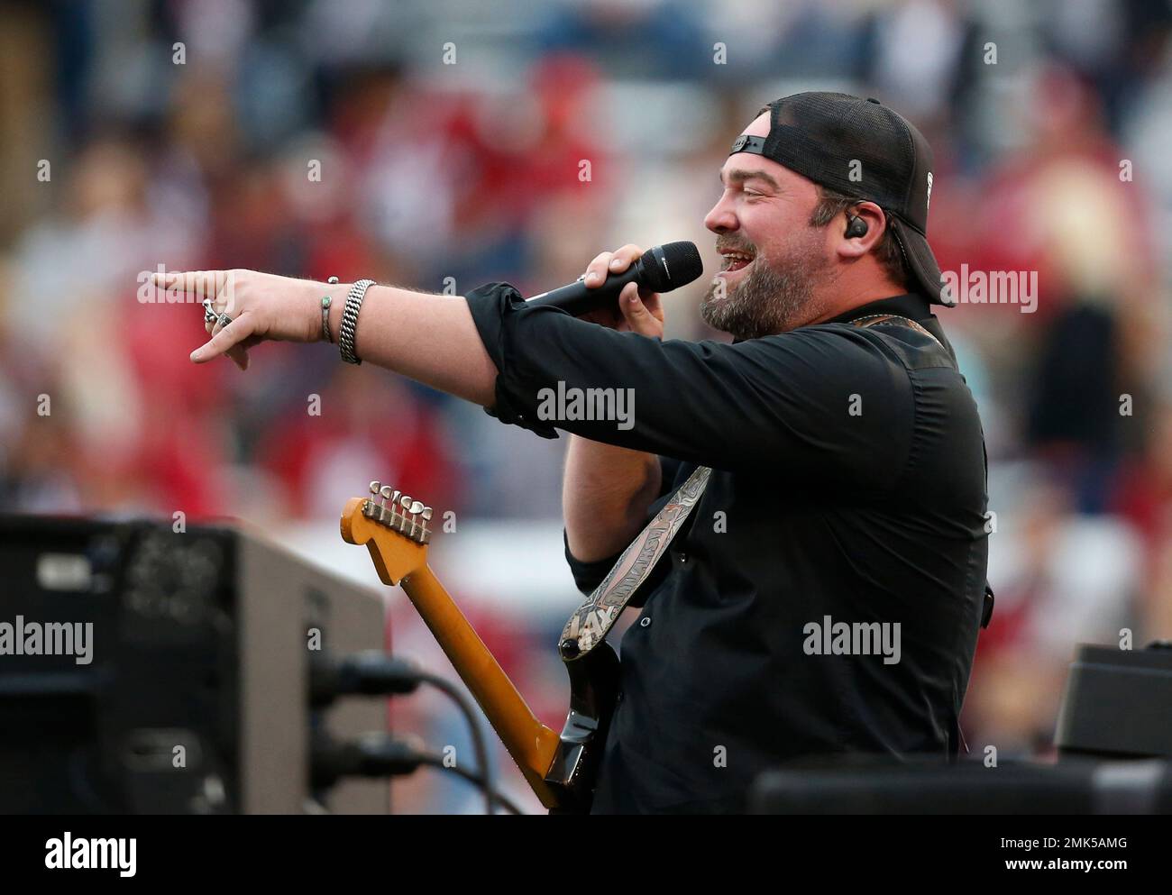 Country music singer Lee Brice performs before an NCAA college football ...