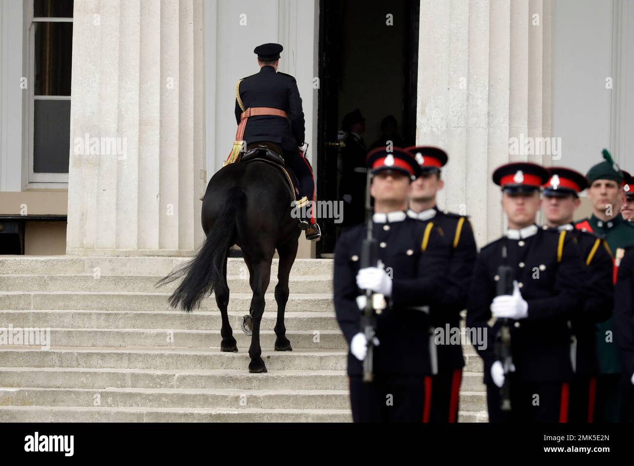 The Sandhurst adjutant rides his horse up the steps of the Old College ...