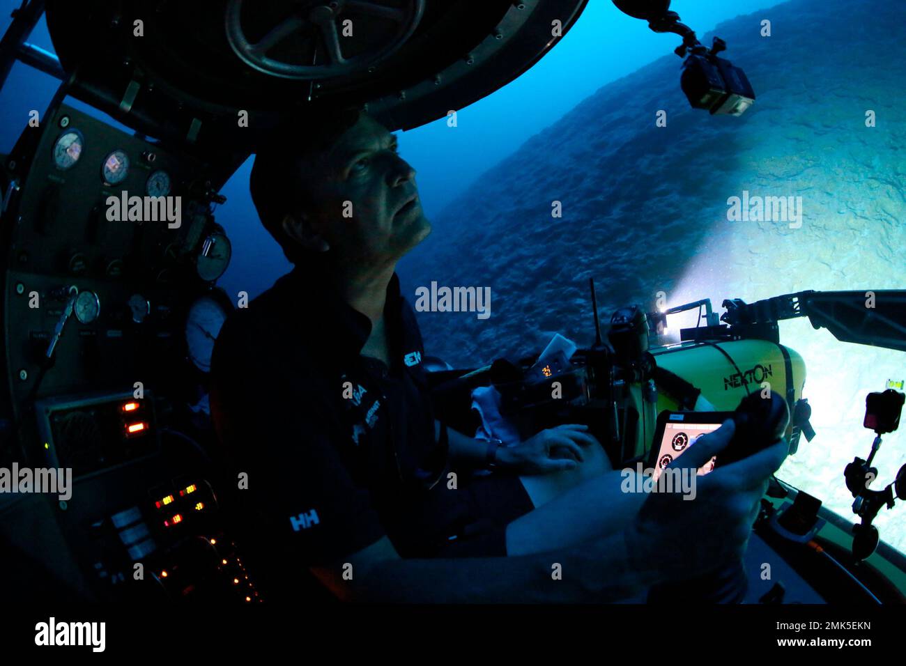 Submersible pilot Robert Carmichael looks out of the submersible as he ...