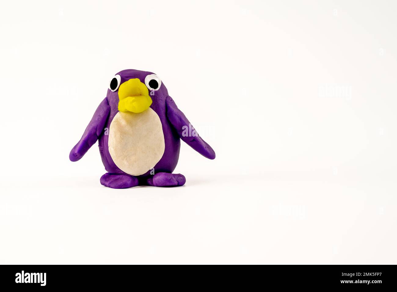 Hand made purple Play dough plasticine penguin with yellow bill ...