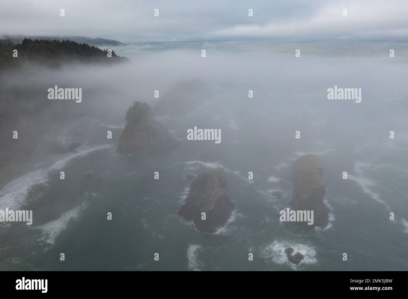 Fog drifts over the beautiful coastline of southern Oregon near ...