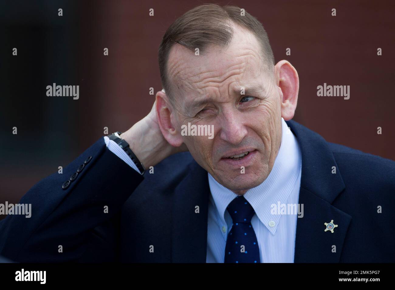 Outgoing Secret Service director Randolph "Tex" Alles stands before a ...