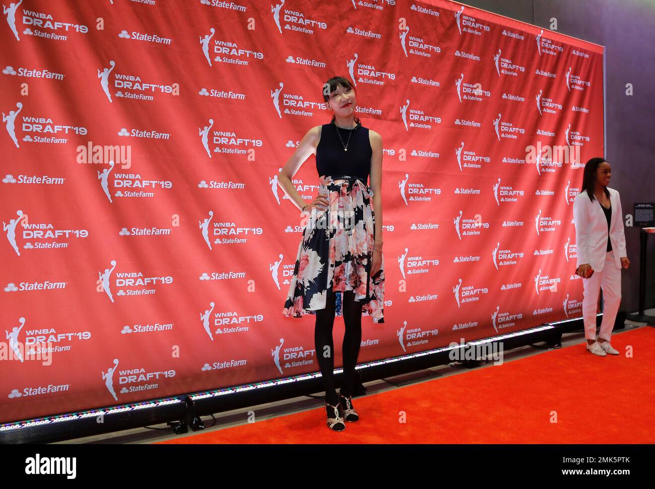 Han Xu poses for photos before the WNBA basketball draft Wednesday ...