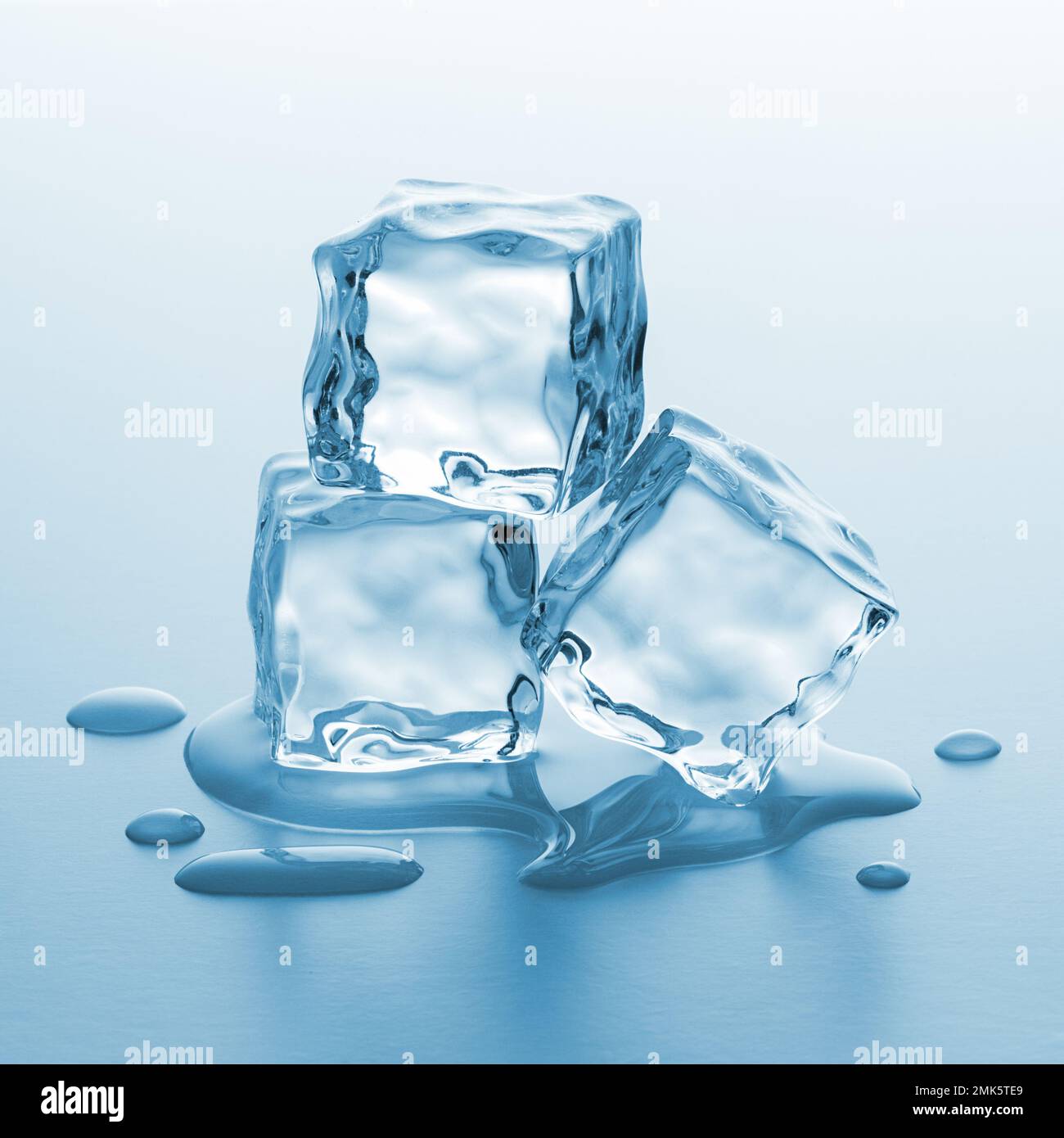 three melting ice cube Stock Photo - Alamy