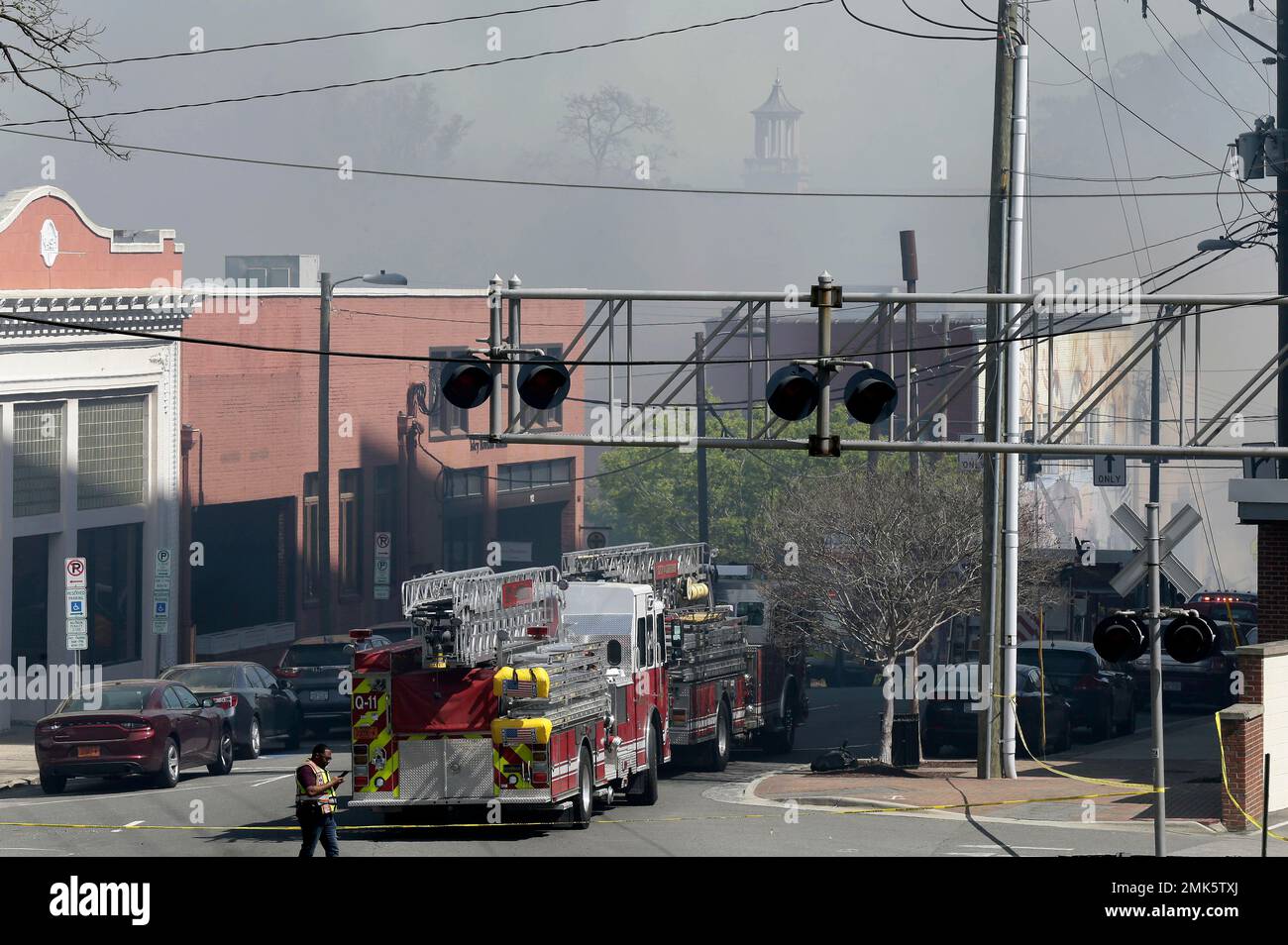 Firefighters and emergency personnel work the scene of an explosion and ...