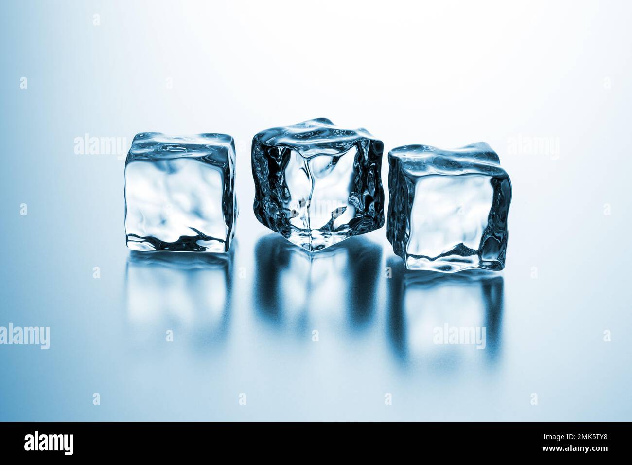 three clear ice cubes Stock Photo - Alamy