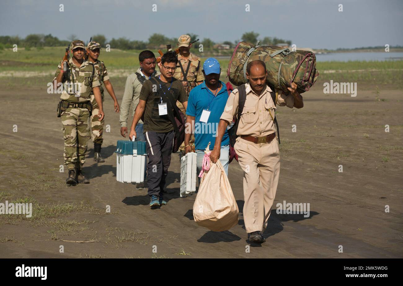 Indian election officials and paramilitary soldiers with election ...