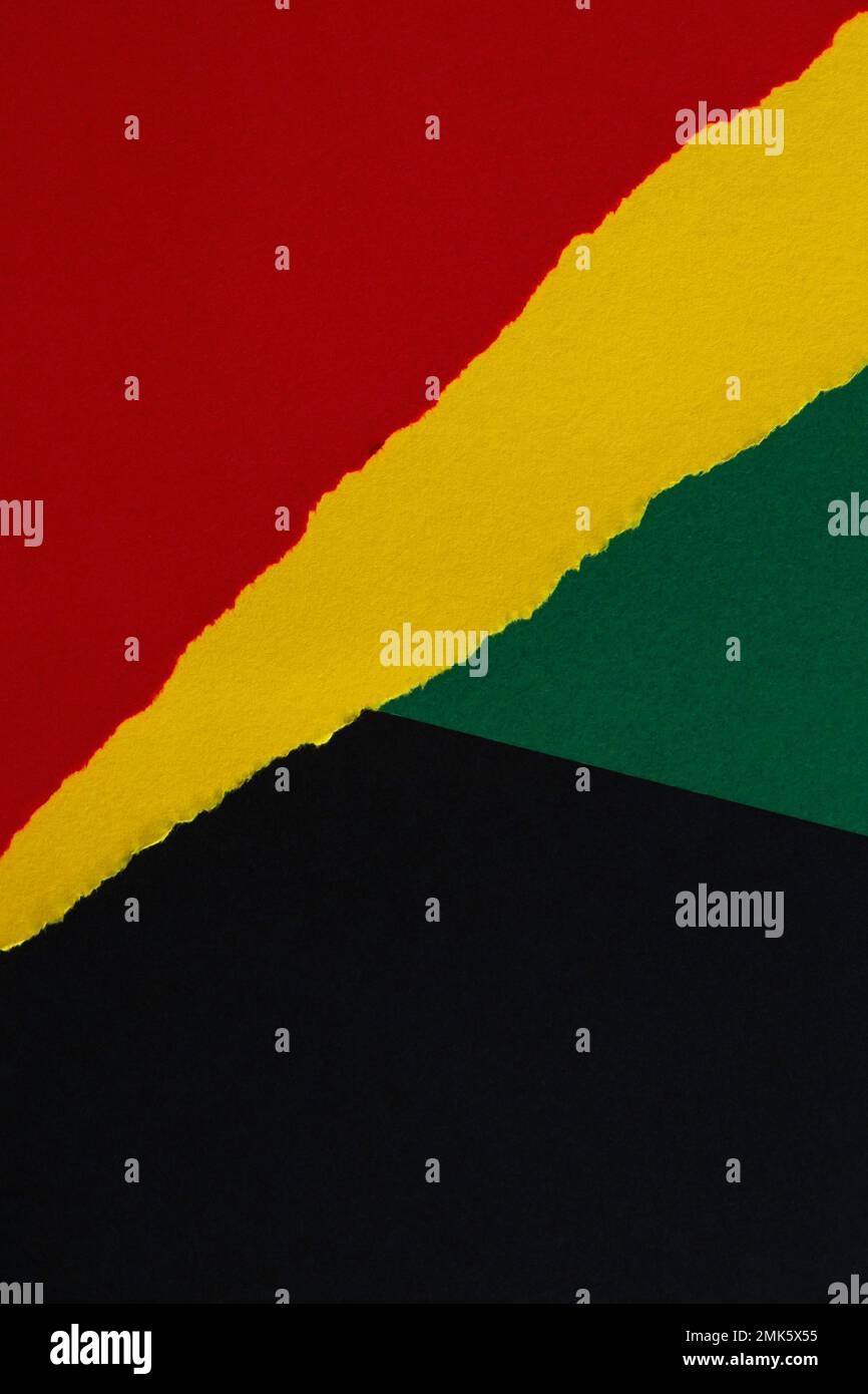 Abstract geometric black, red, yellow, green color paper background ...