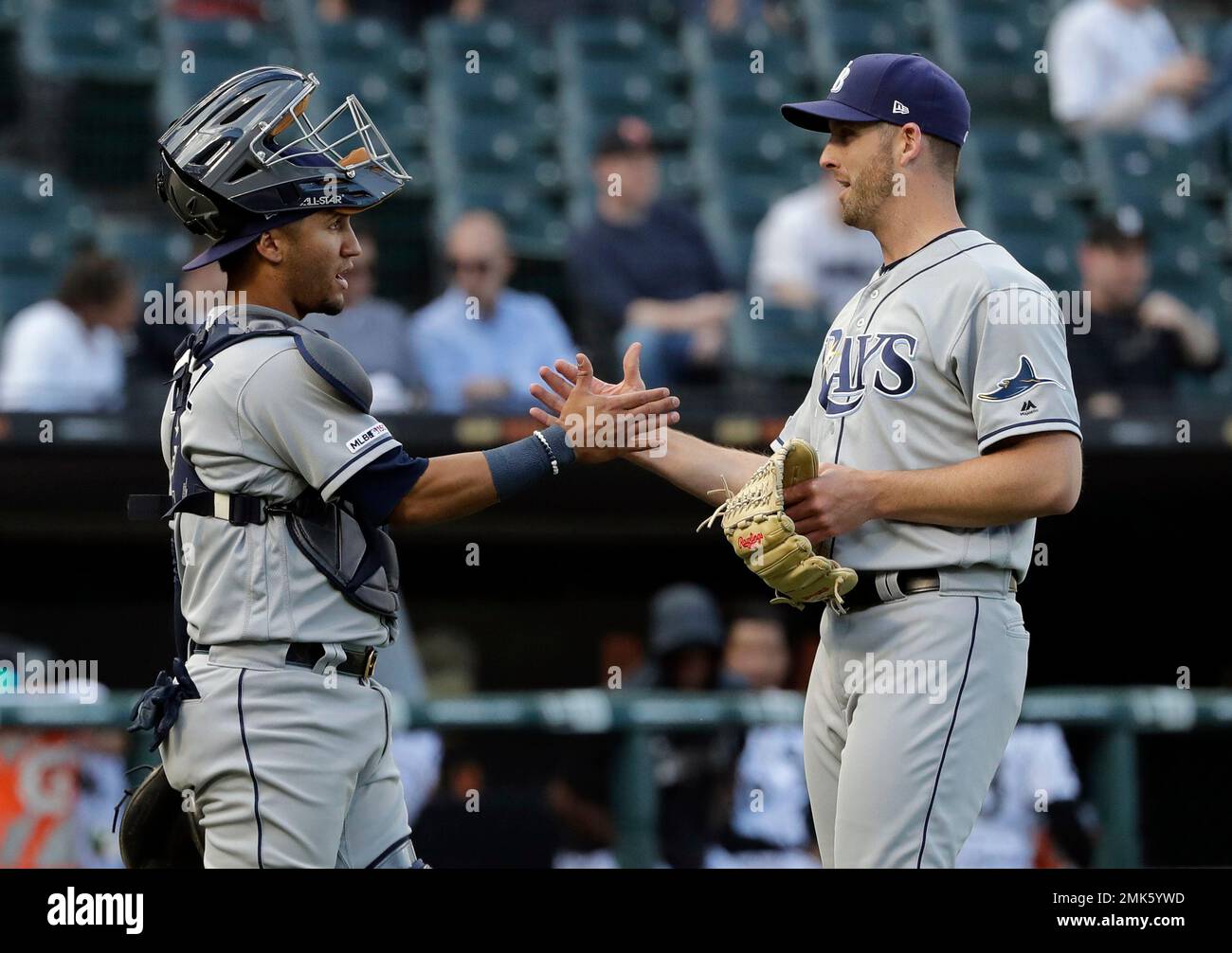Tampa Bay Rays relief pitcher Adam Kolarek, right, celebrates with ...