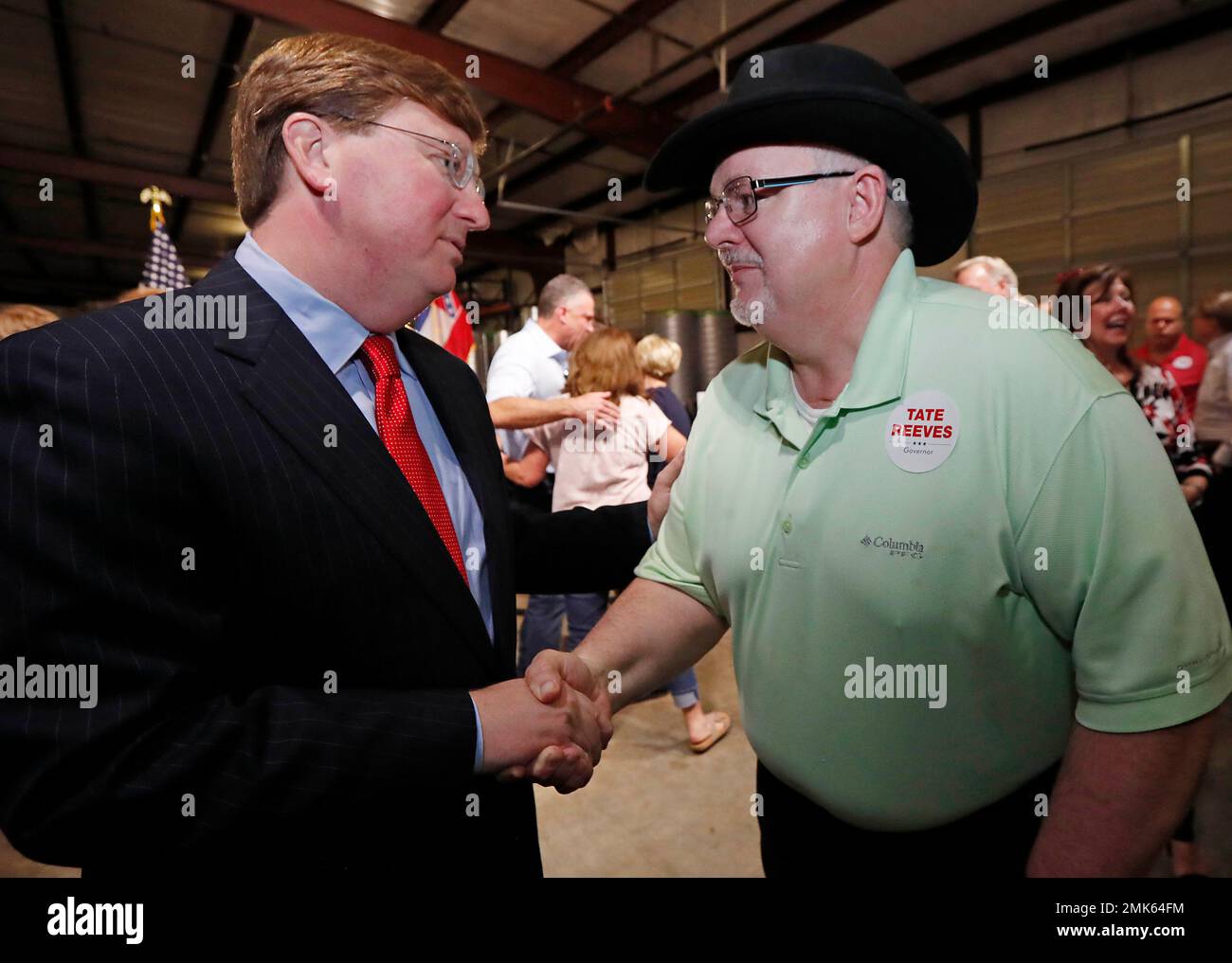 Republican Lt. Gov. Tate Reeves, left, shakes supporter Gaylon Smith's ...