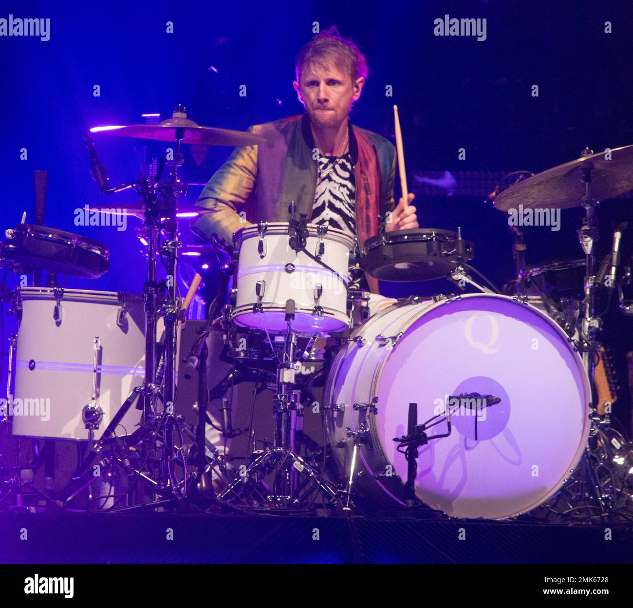 Dominic Howard of the band Muse performs in concert during their ...