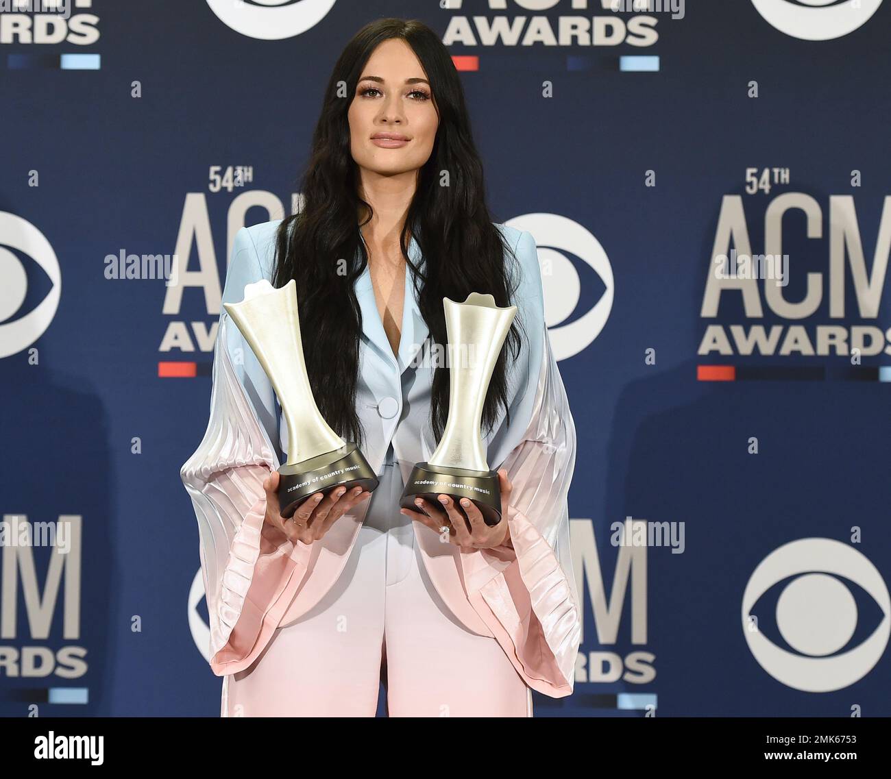 Kacey Musgraves poses in the press room with the awards for album of ...