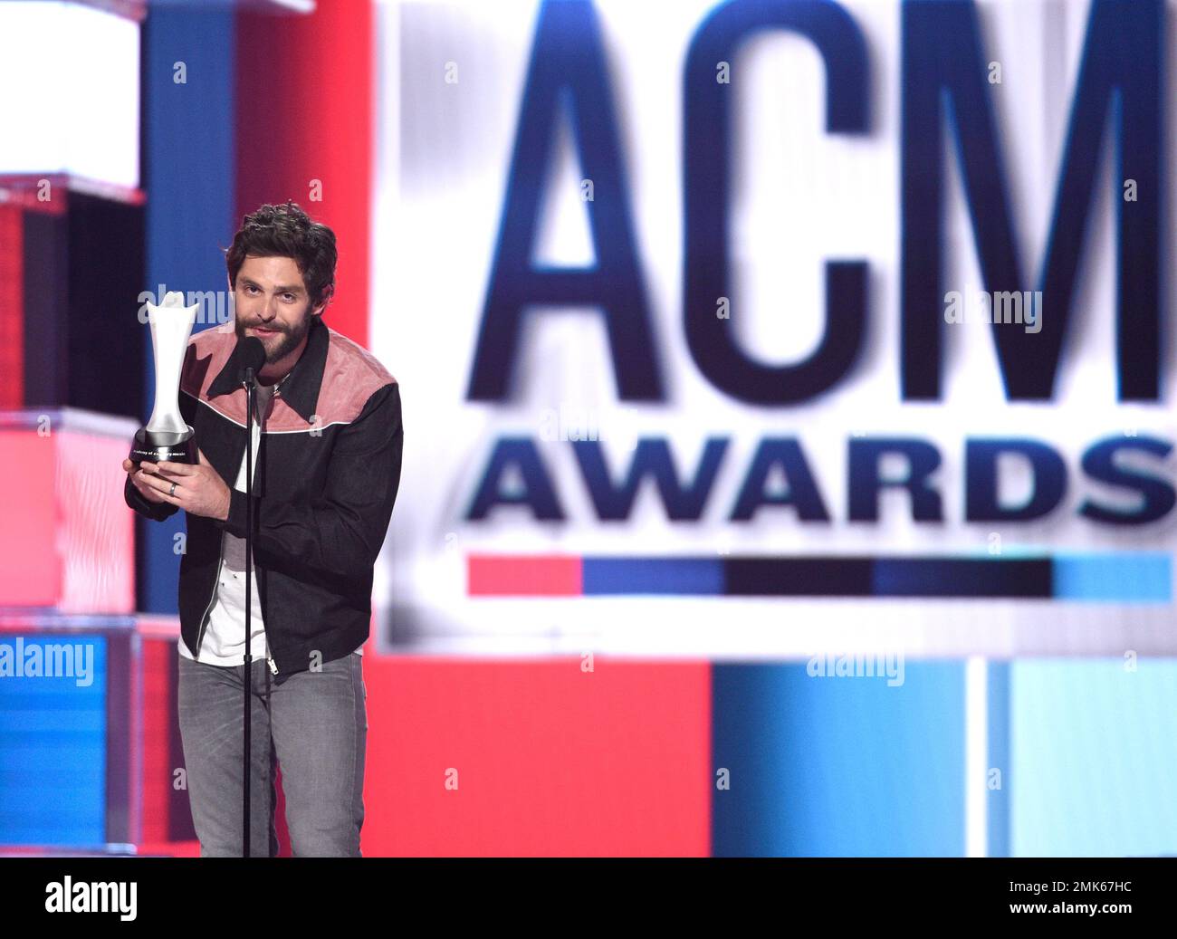 Thomas Rhett accepts the award for male artist of the year at the 54th ...