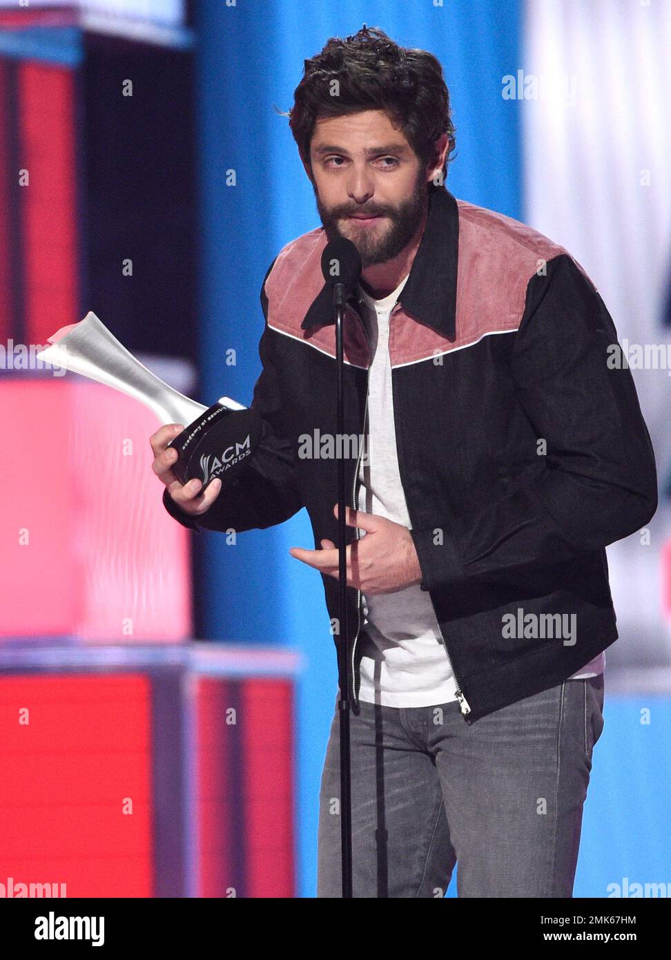 Thomas Rhett accepts the award for male artist of the year at the 54th ...