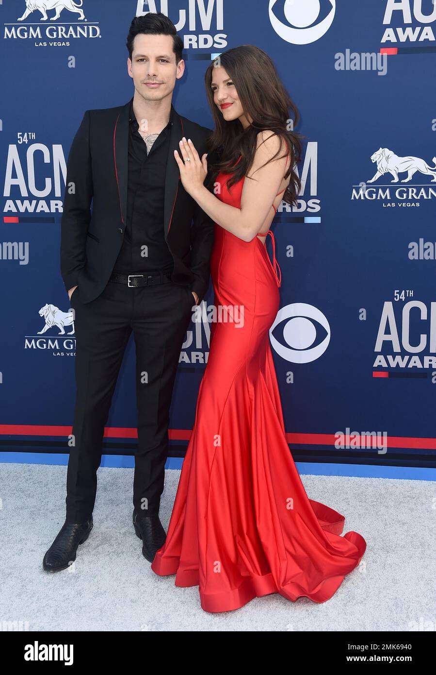 Devin Dawson, left, and Leah Sykes arrive at the 54th annual Academy of ...