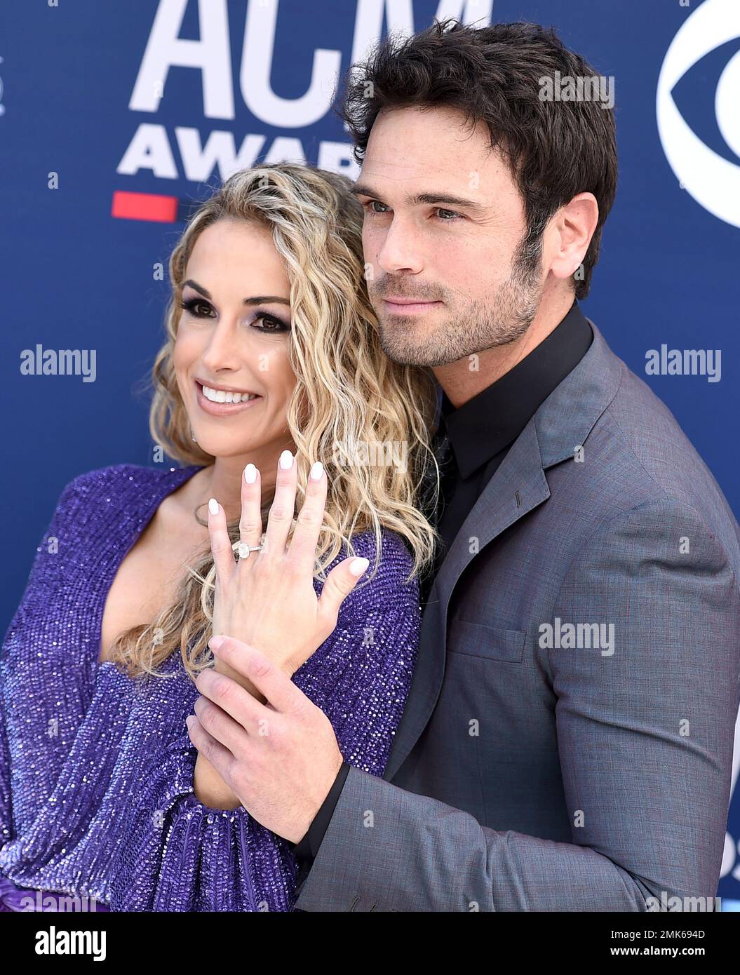 Chuck Wicks, right, and Kasi Williams show off an engagement ring as ...