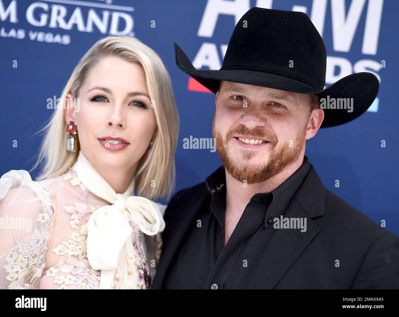 Cody Johnson, right, and Brandi Johnson arrive at the 54th annual ...
