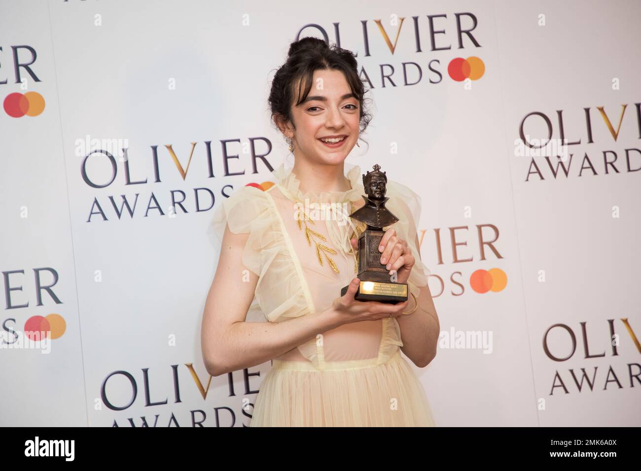 Actress Patsy Ferran poses for photographers backstage with her Best ...