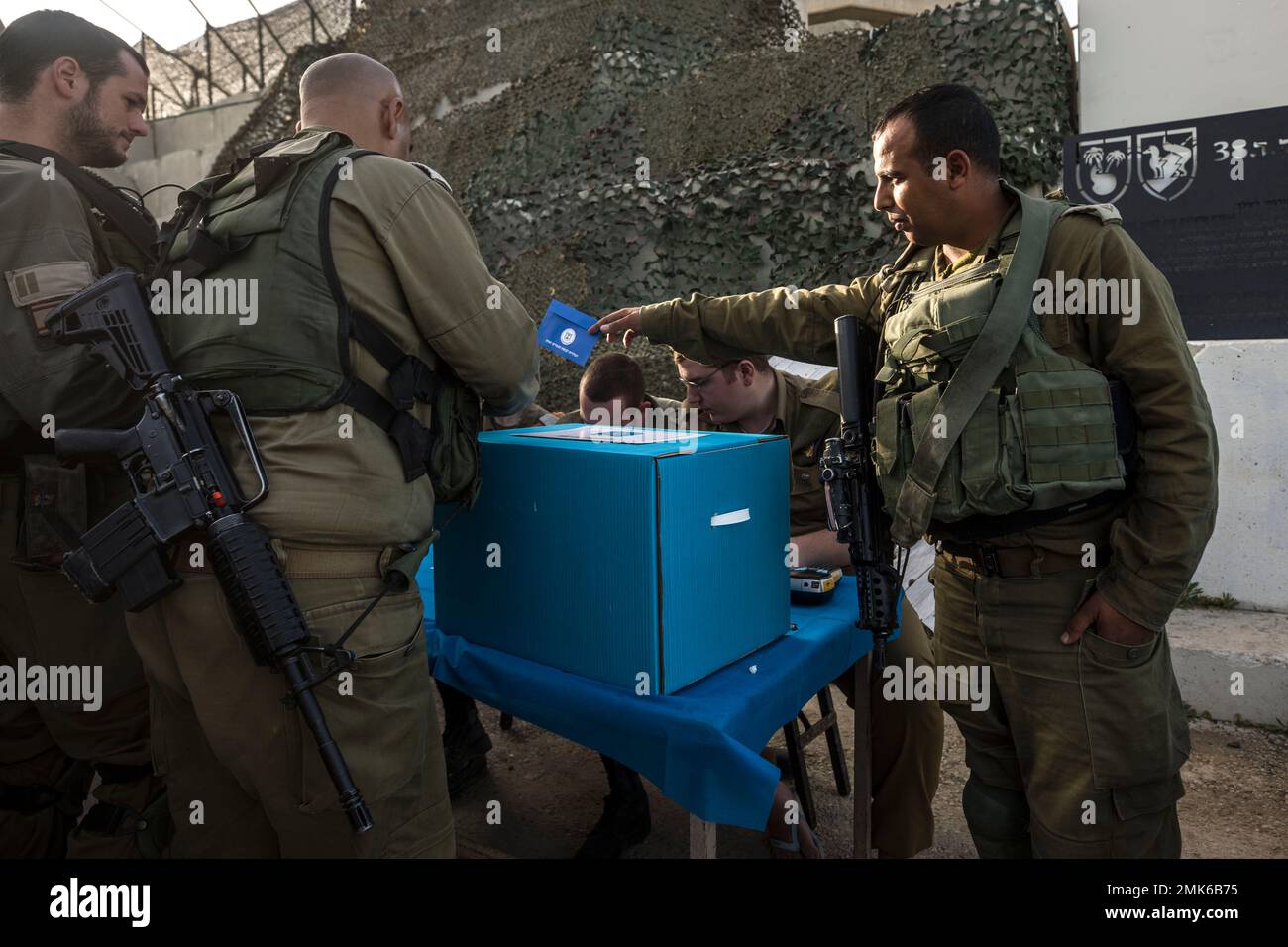 Israeli soldiers cast their ballots oat a mobile voting booth, two days ...