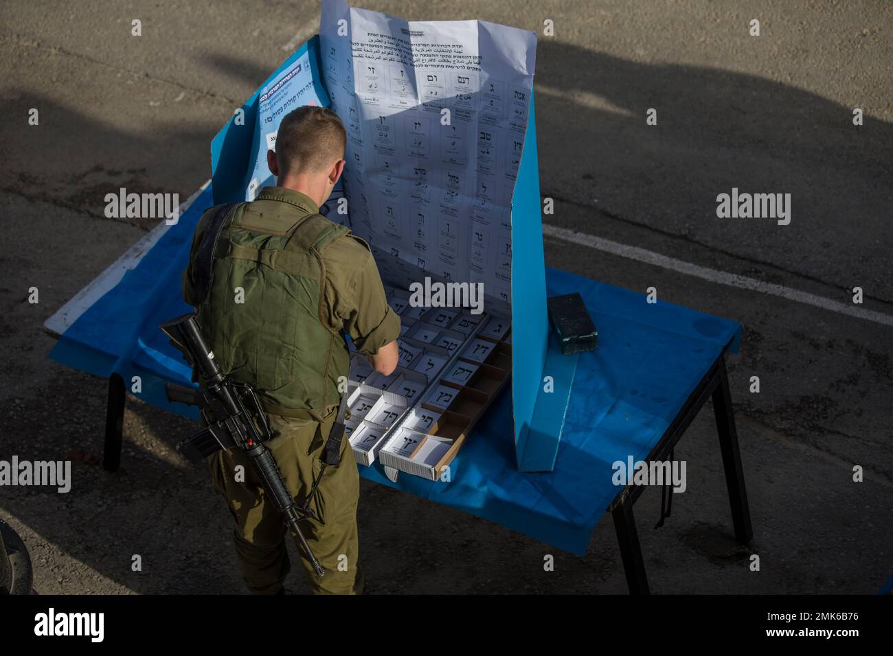 Israeli soldiers cast their ballots oat a mobile voting booth, two days ...
