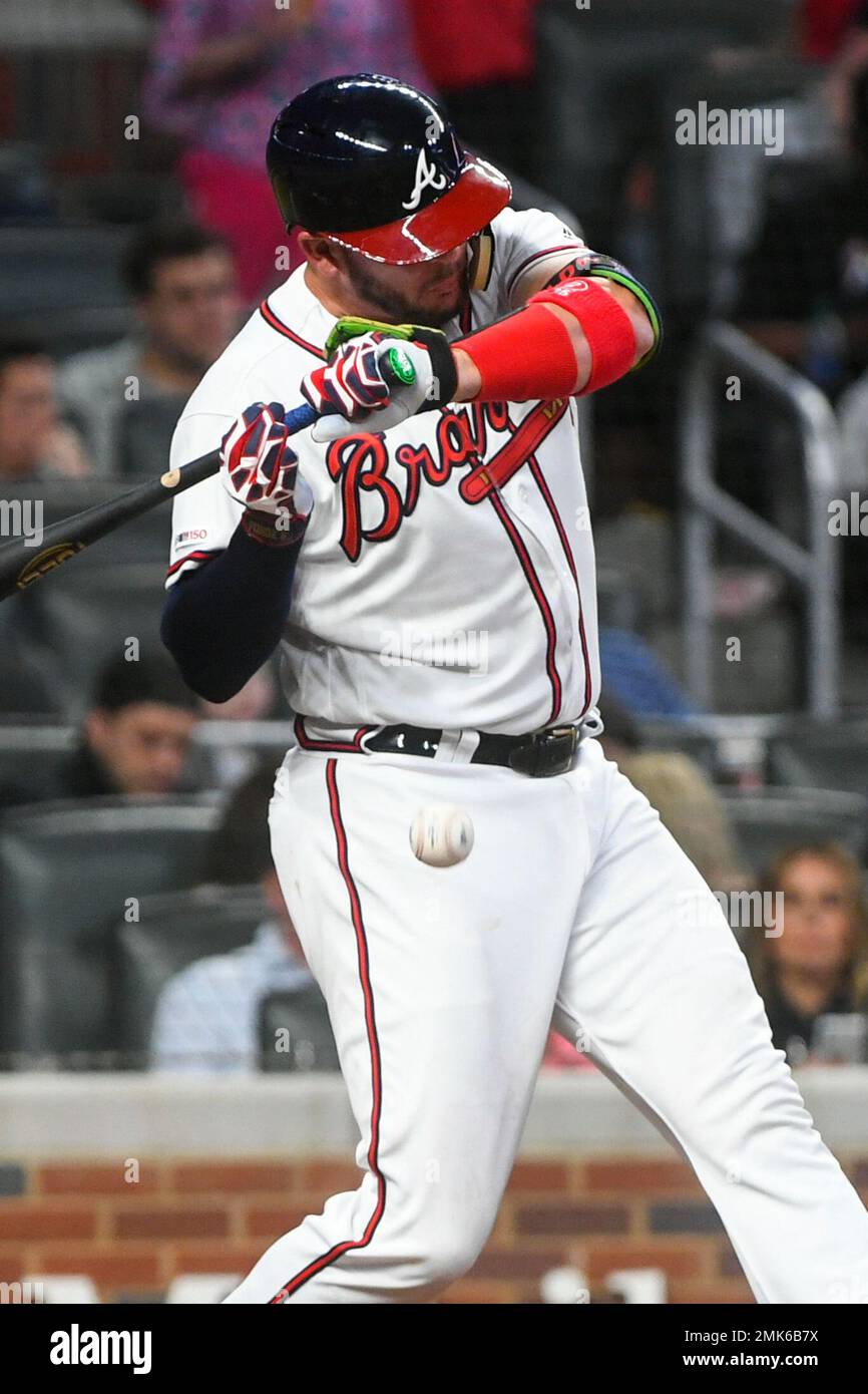 Atlanta Braves catcher Tyler Flowers is hit by a pitch during a ...