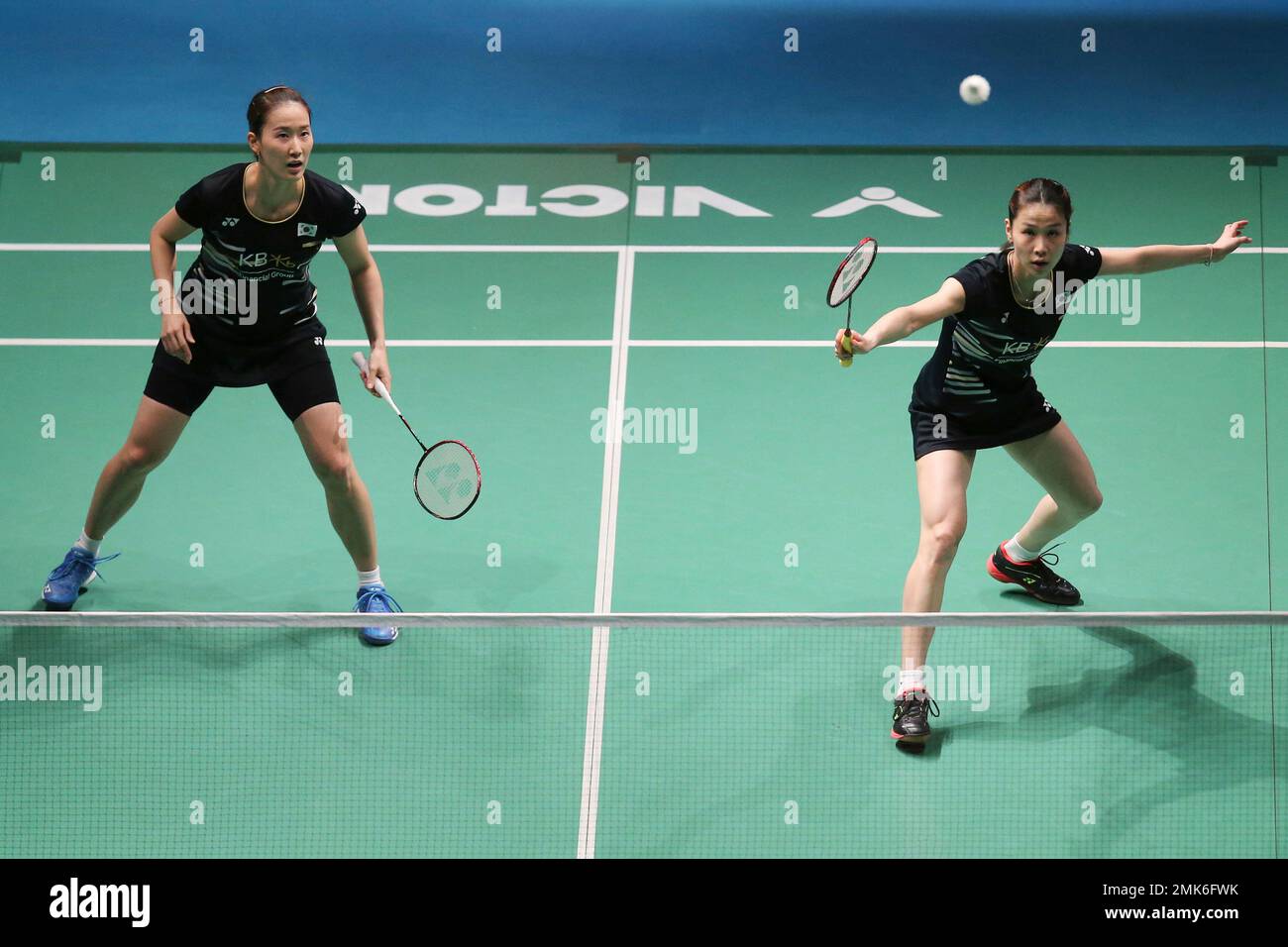 South Korea's Jung Kyung Eun, right, returns a shot as teammate Chang ...