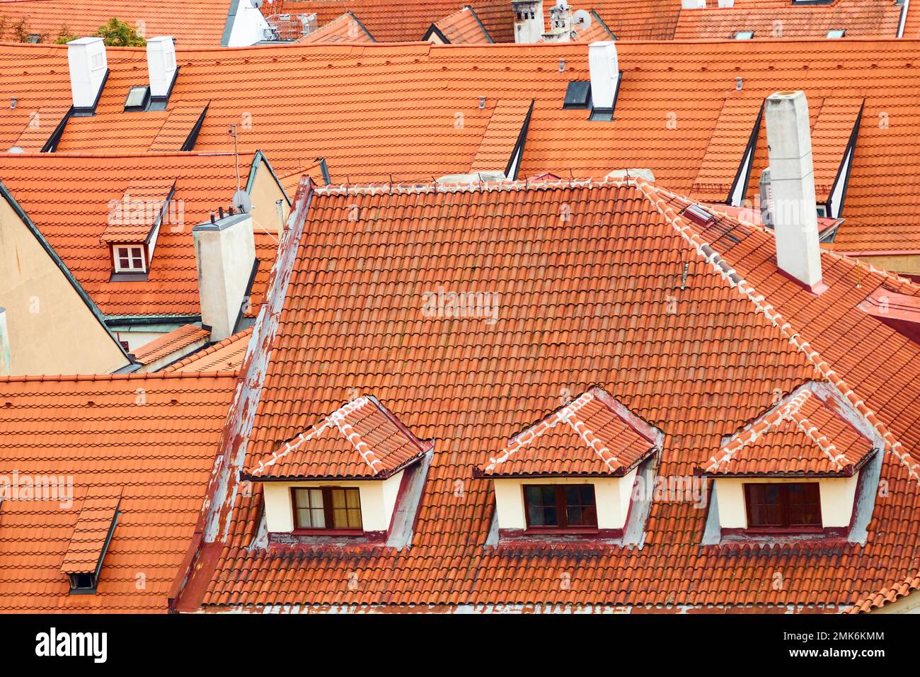 Tile orange roof of buildings in Prague during journey Stock Photo - Alamy