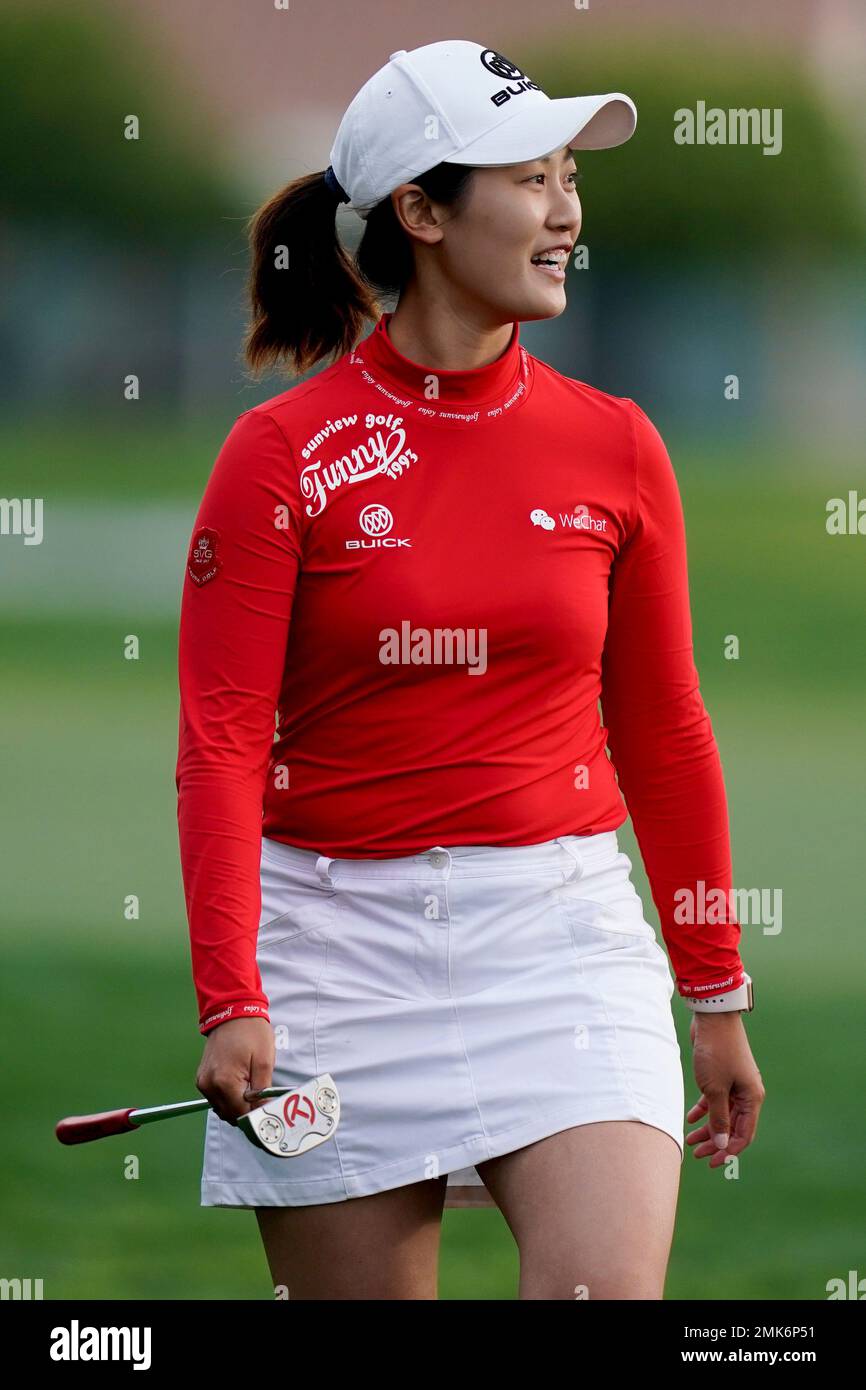 Xiyu Lin of China, walks to the 18th green during the first round of ...