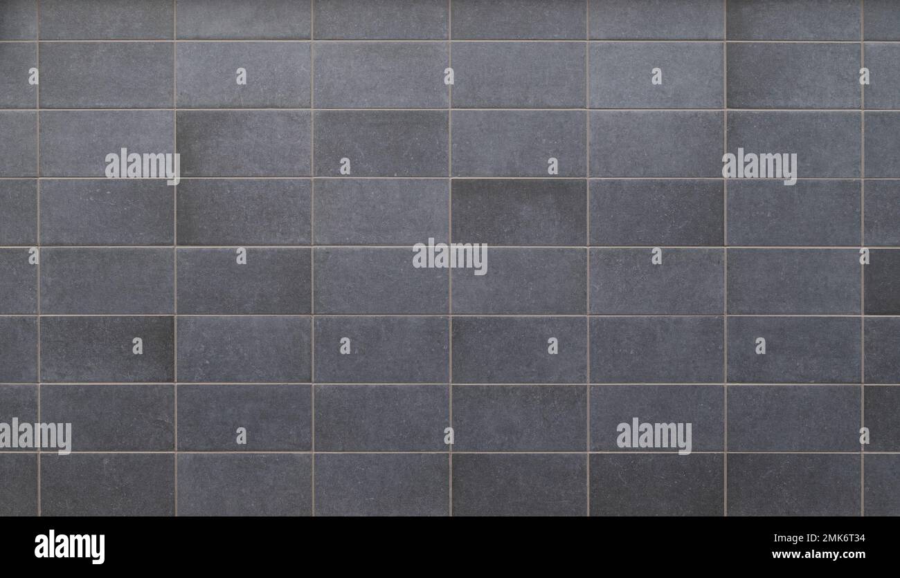 Front view of a wall made of gray slabs. Abstract full frame background ...