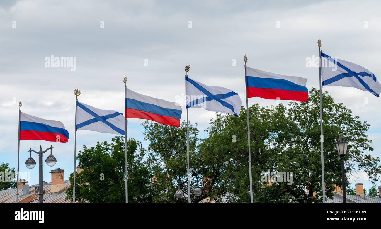 Flagpoles with Russian and St. Andrew's flags on the embankment in St ...