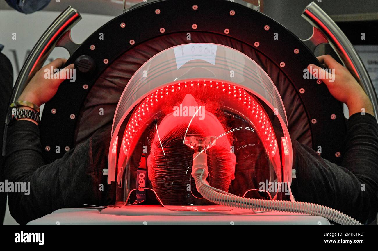 A man lies in a body rejuvenator tube at the world's largest fitness ...