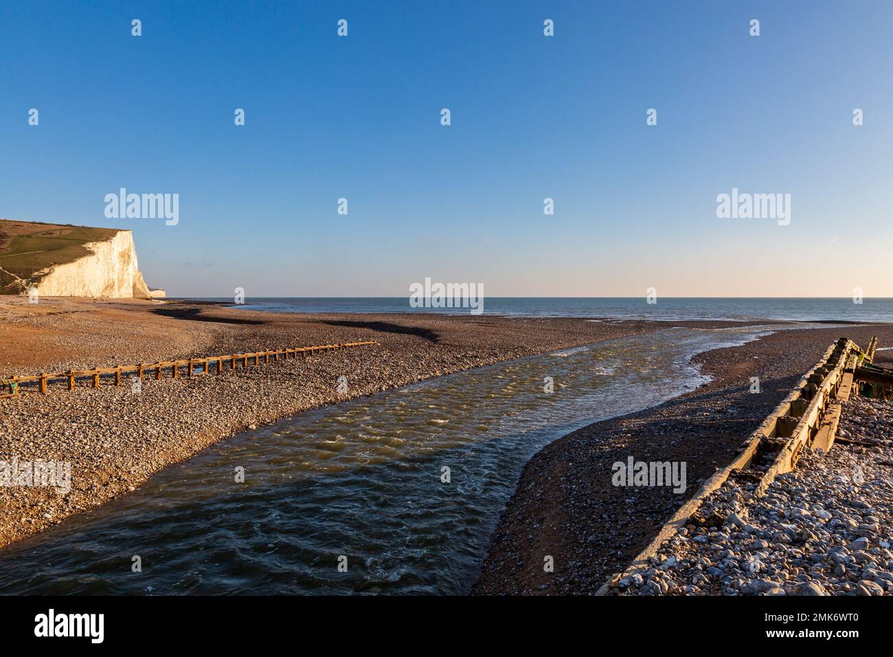 The River Cuckmere flowing into the sea, at Cuckmere Haven in Sussex ...