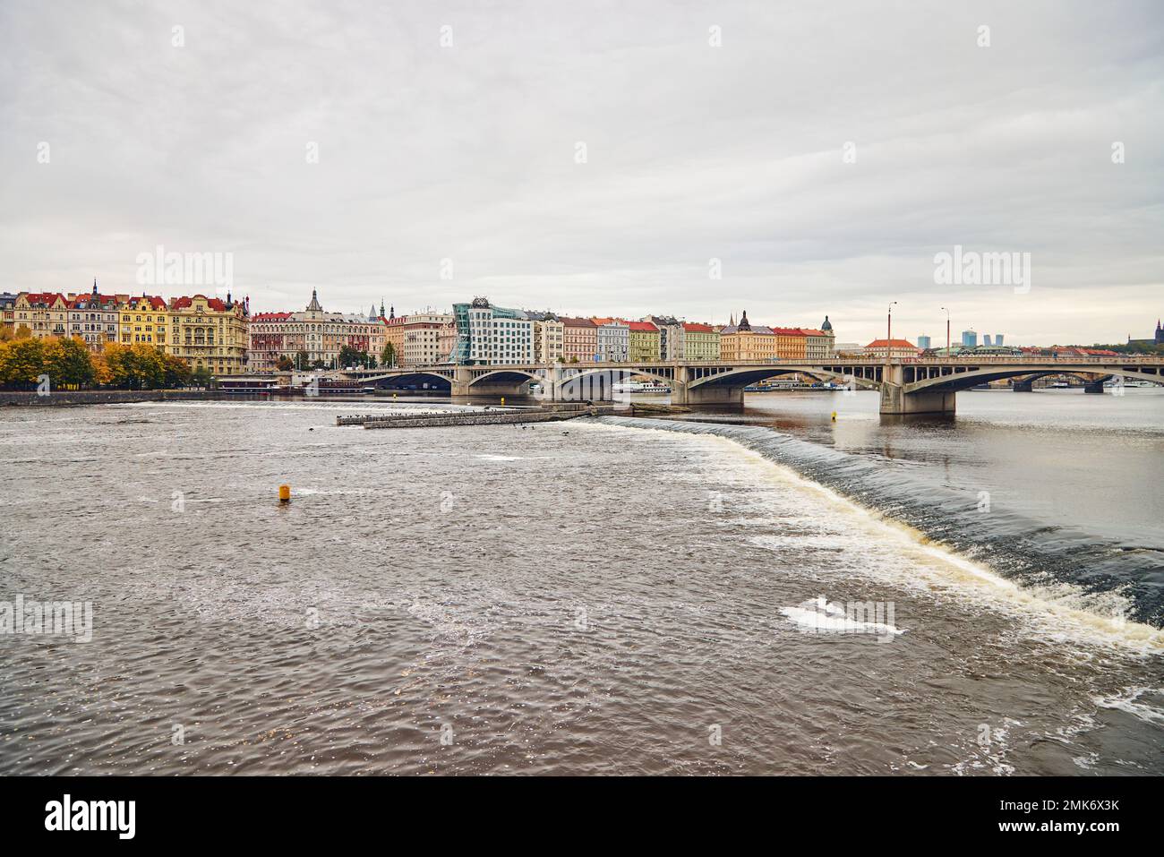 Wide view of Jirasek Bridge, colorful historical buildings and Dancing ...