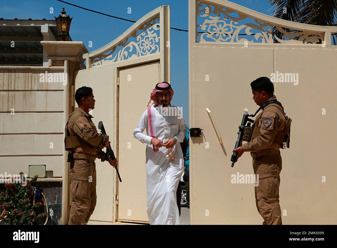 A member of the Saudi Arabia delegation arrives for the opening ...