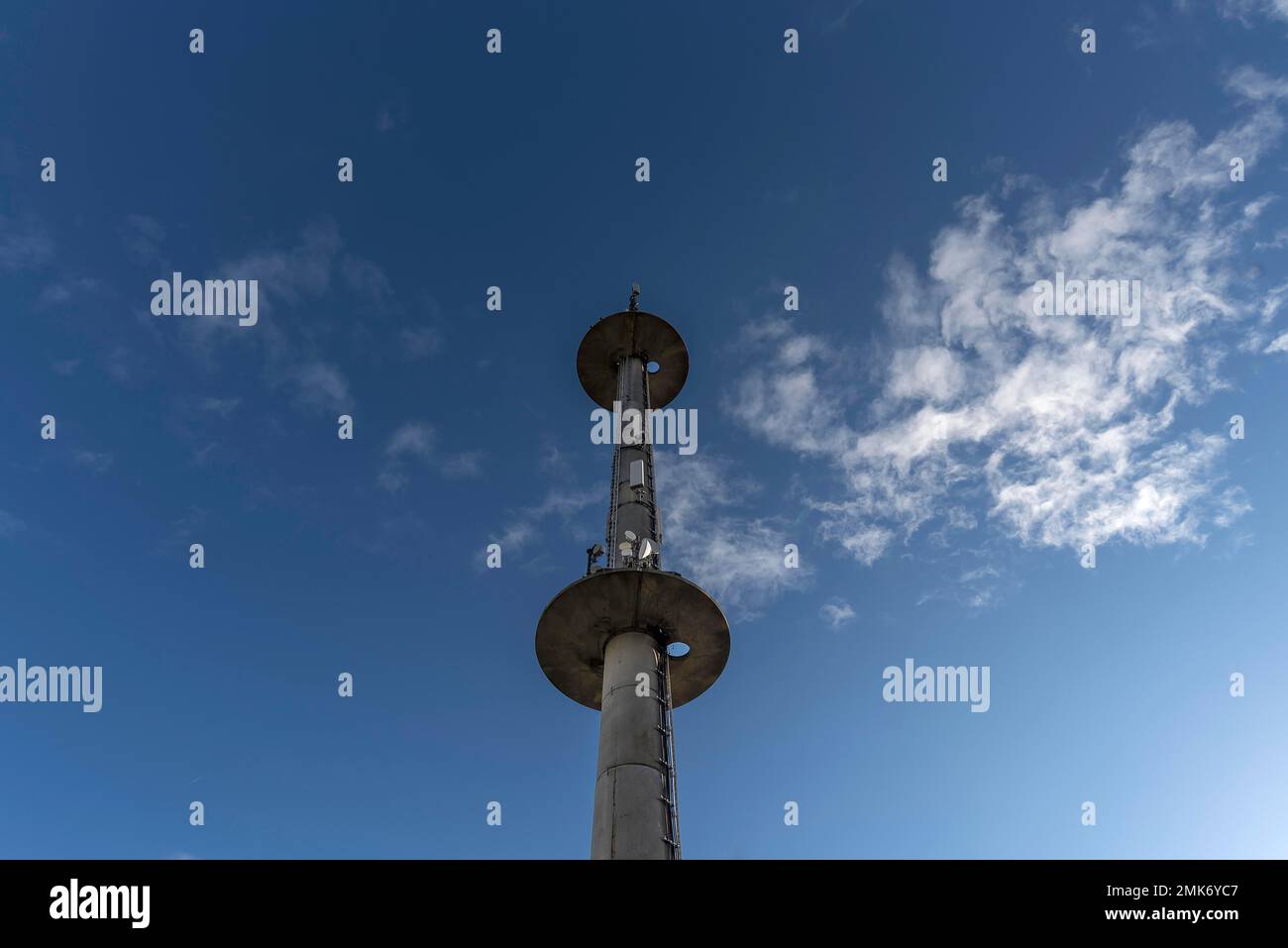 Transmission mast in cloudy sky, Bavaria, Germany Stock Photo - Alamy