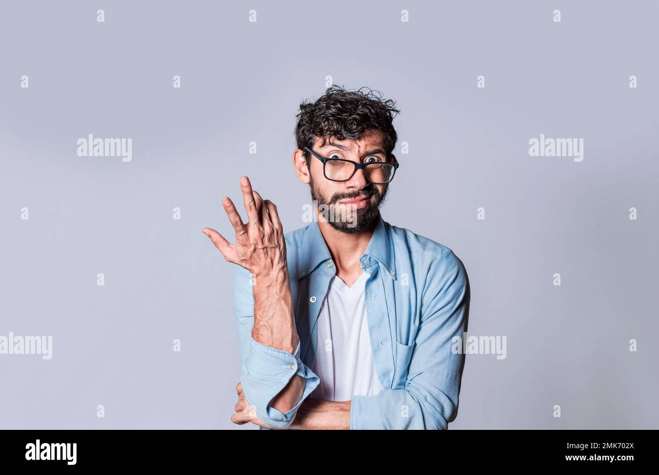 Puzzled man on isolated background, face of a puzzled and skeptical guy ...