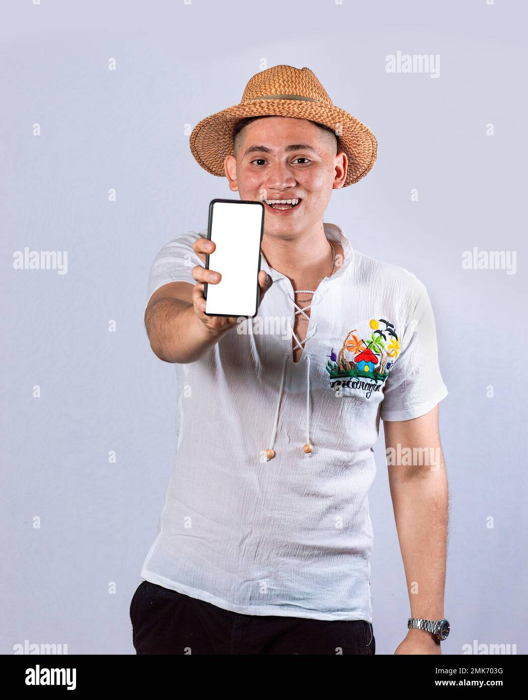 Man with beach hat showing the screen of his cell phone, man showing ...