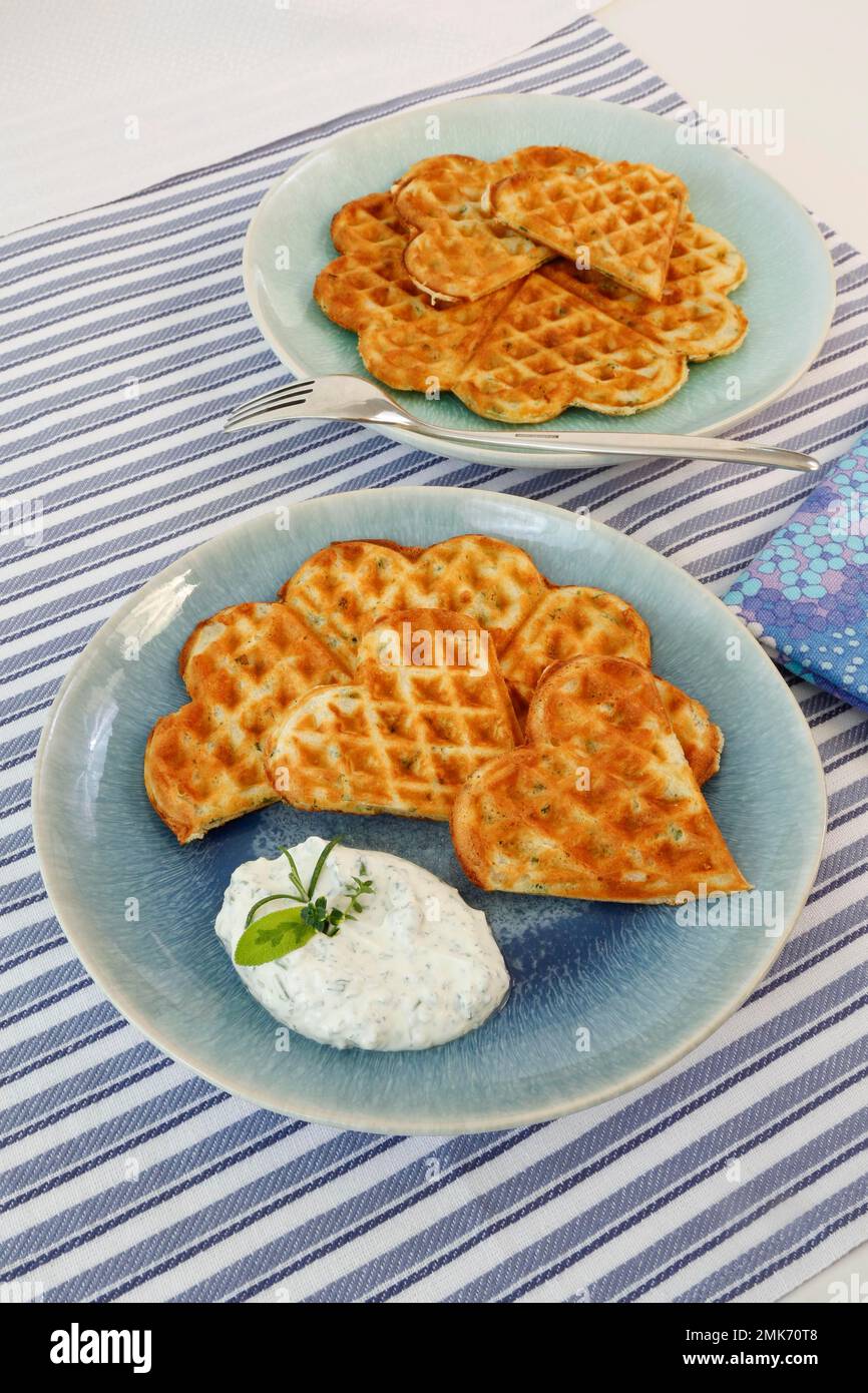 Southern German cuisine, waffles with herb curd cheese on plate, fork ...