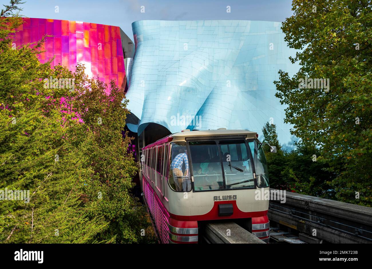Monorail train comes out of the museum, Corrugated coloured exterior ...