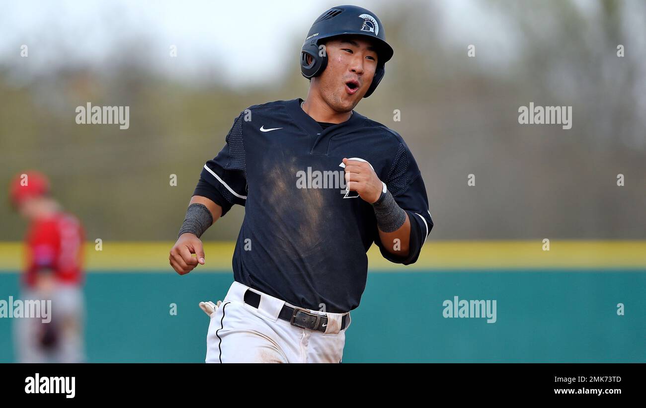 USC Upstate's Andres Kim rounds third base after teammate Jeff Taylor ...