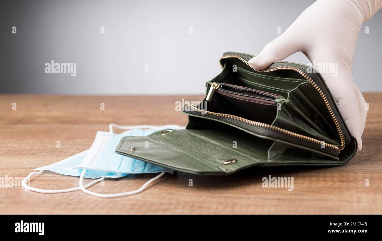 woman holding empty wallet face mask. High resolution photo Stock Photo ...