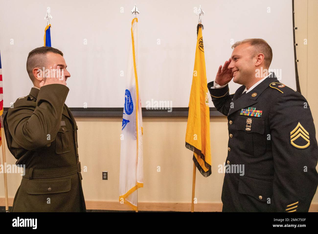 U.S. Army 2nd Lt. Michael Cotto, left, a field artillery officer ...