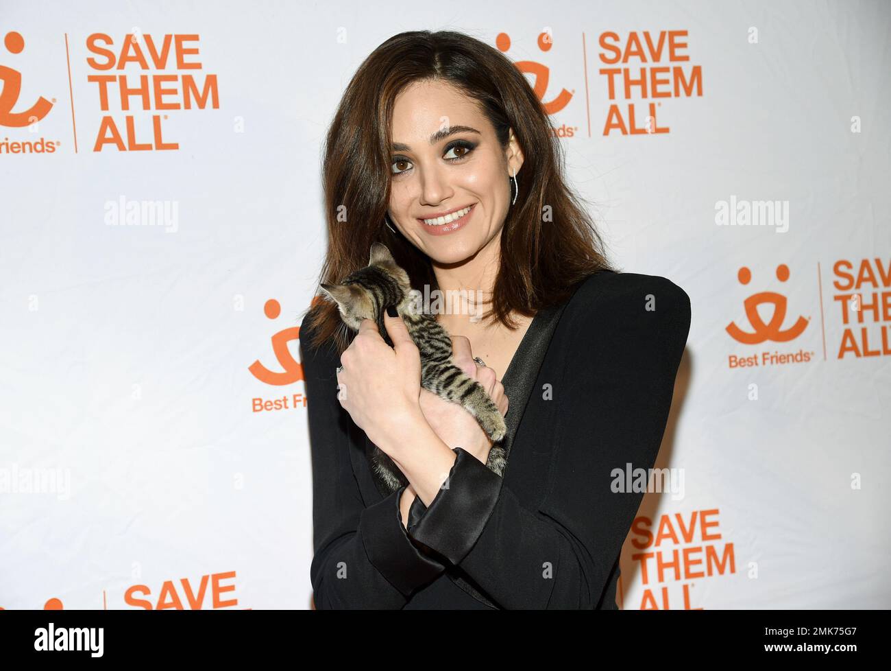 Actress Emmy Rossum poses with a kitten at the fourth annual Best ...