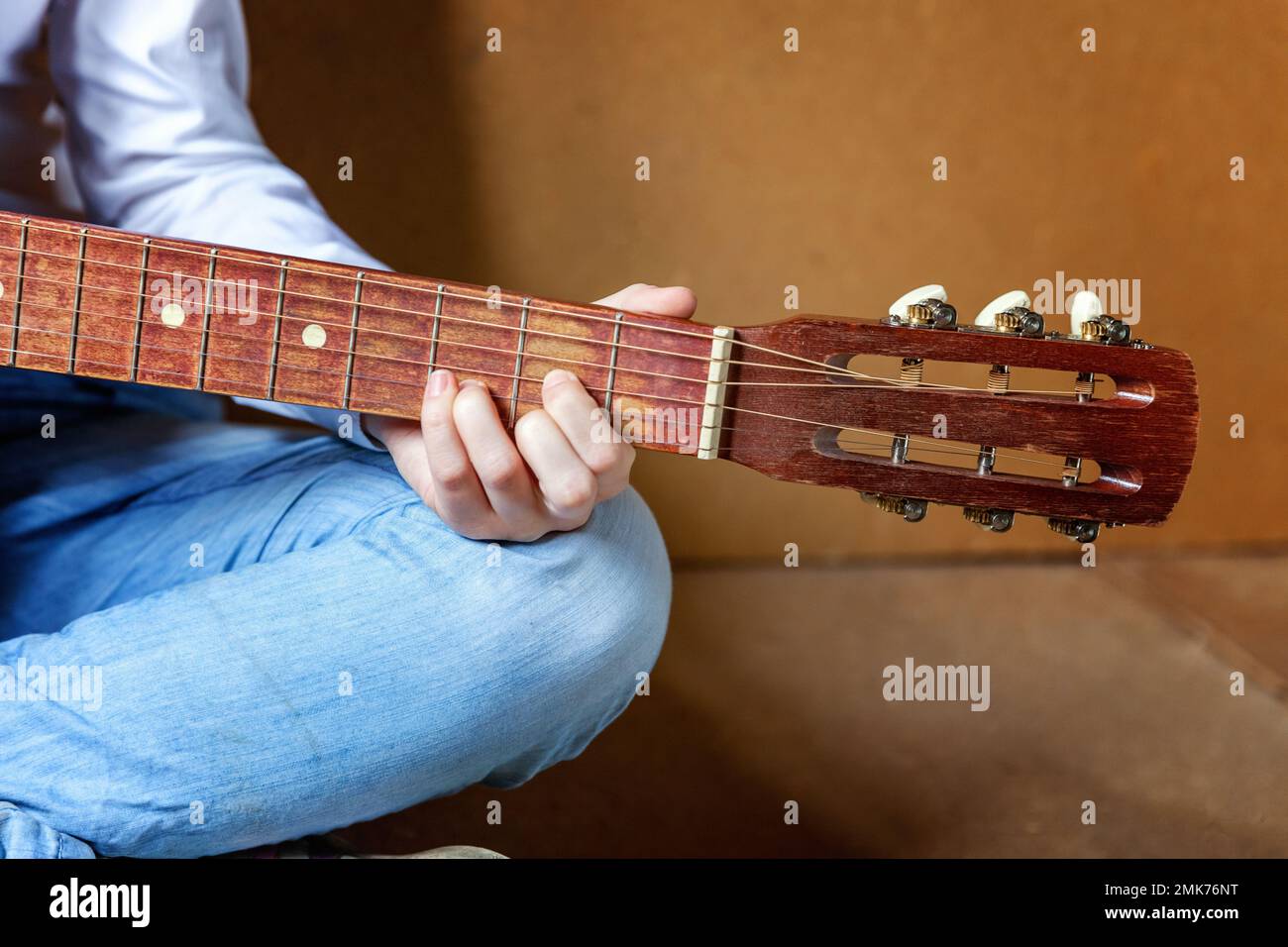Young hipster woman hands playing guitar at home. Teen girl learning to ...