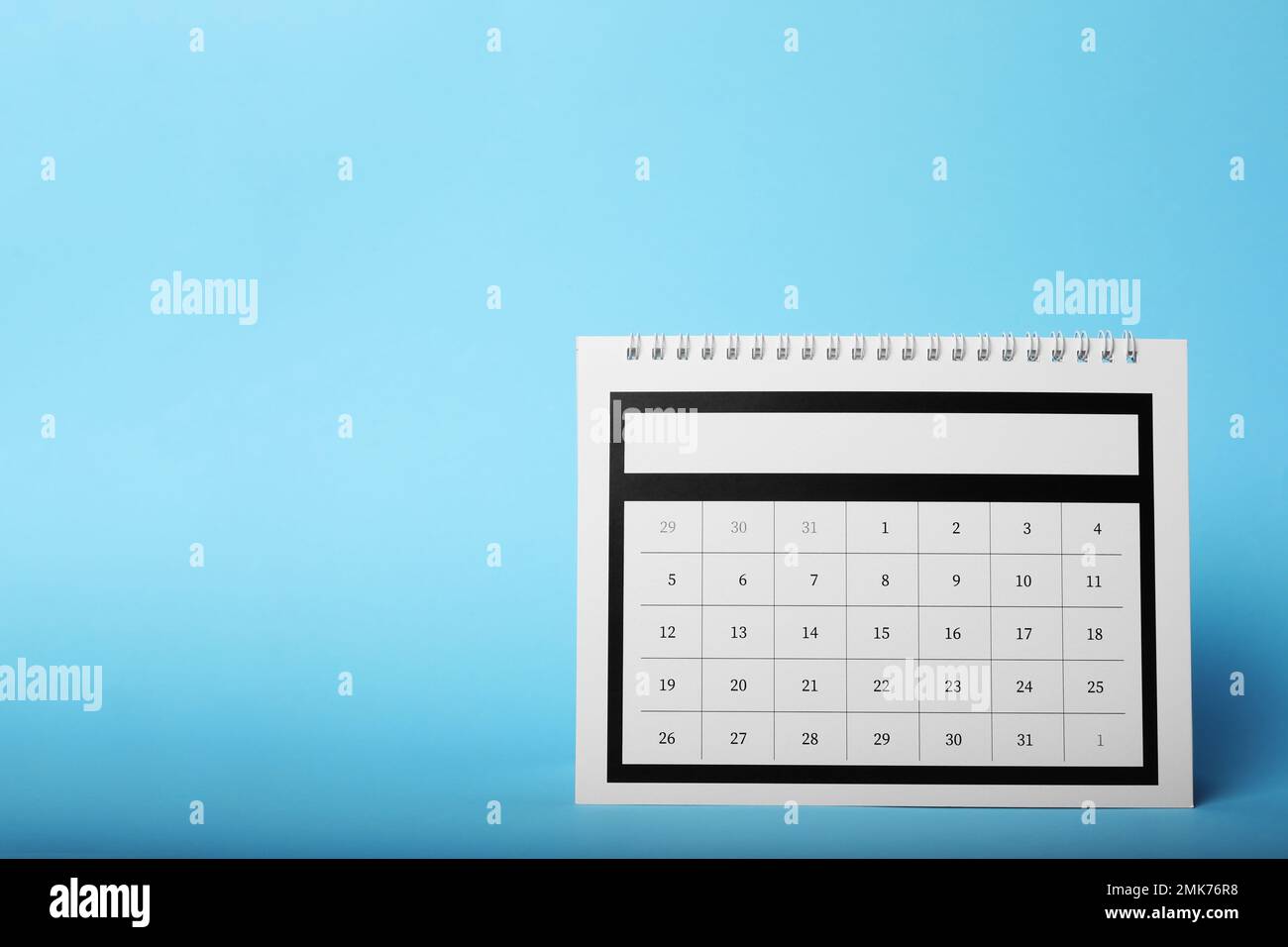 Paper calendar on light blue background, space for text. Planning ...