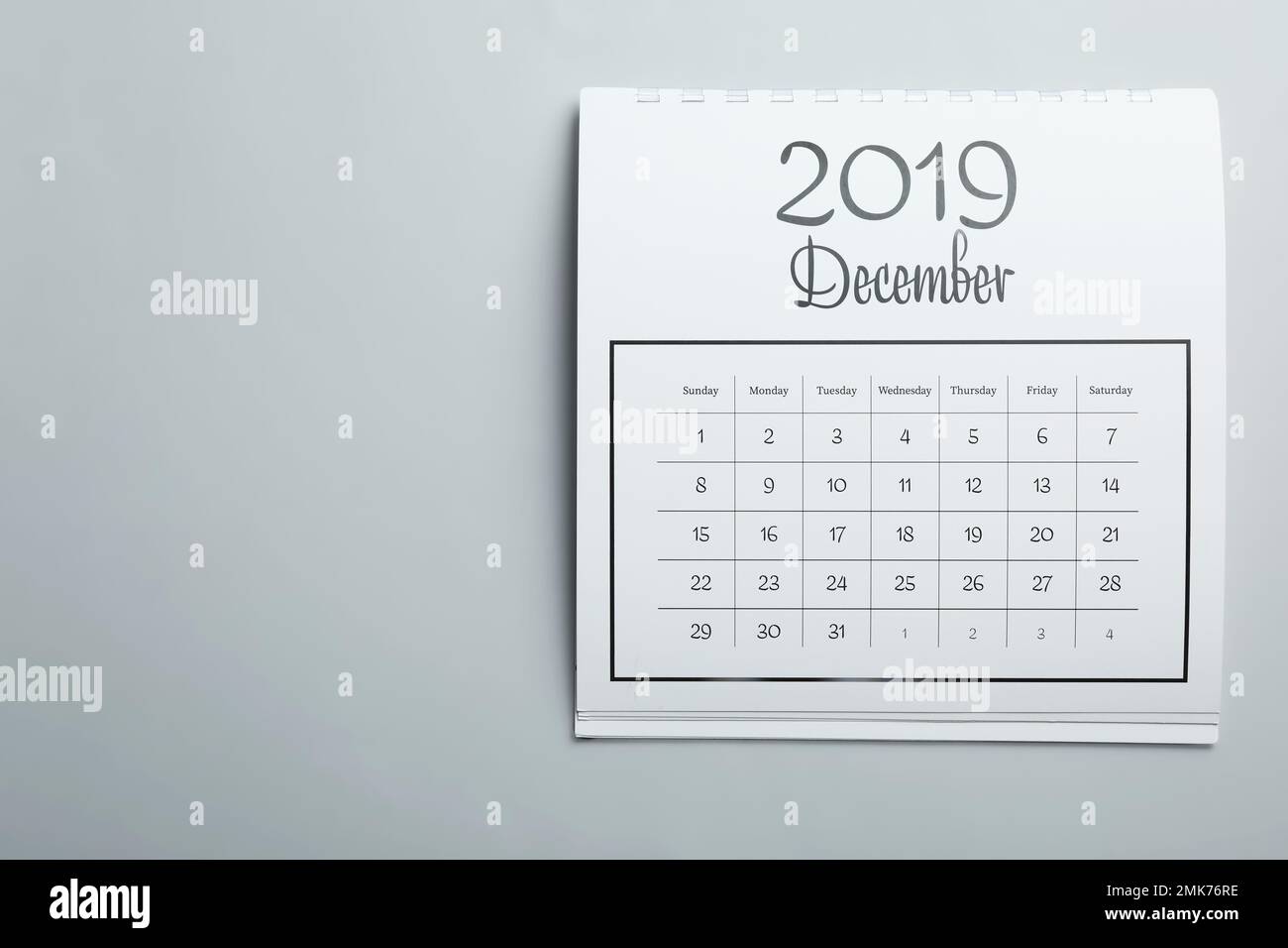 December 2019 calendar on light grey background, top view. Space for ...
